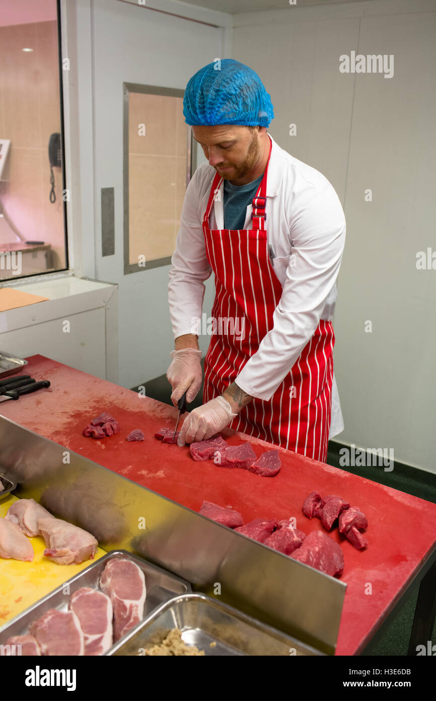 Butcher chopping red meat Stock Photo - Alamy