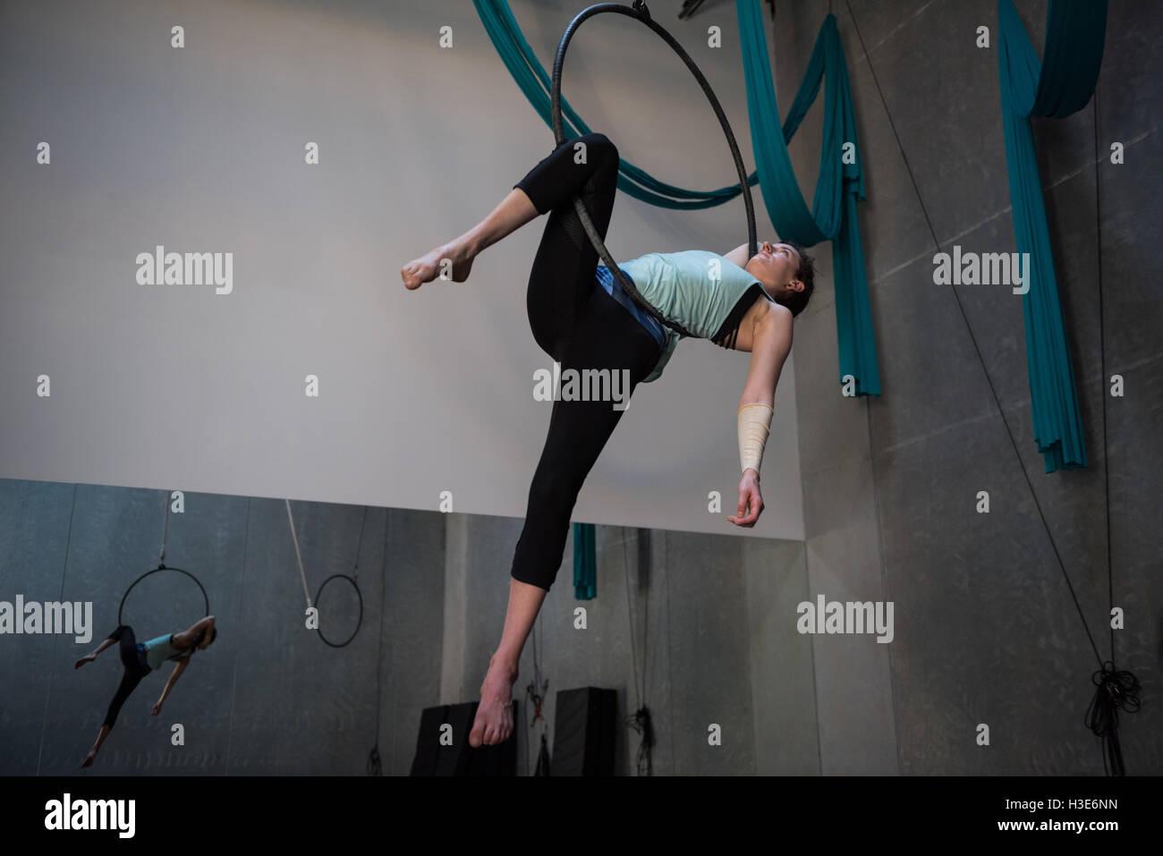Gymnast performing gymnastics on hoop Stock Photo - Alamy