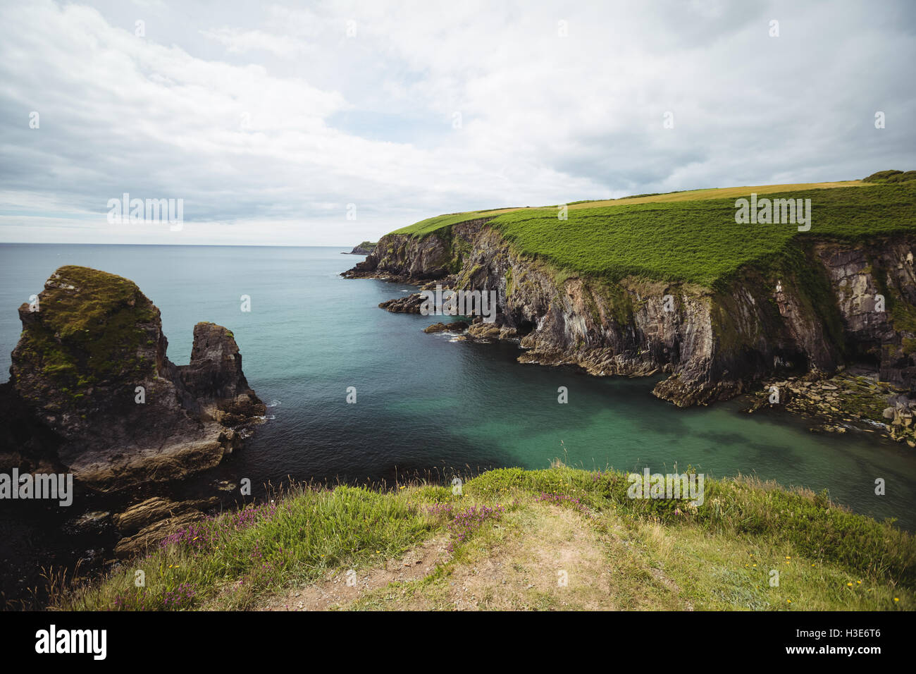 View of rock formation and sea Stock Photo - Alamy