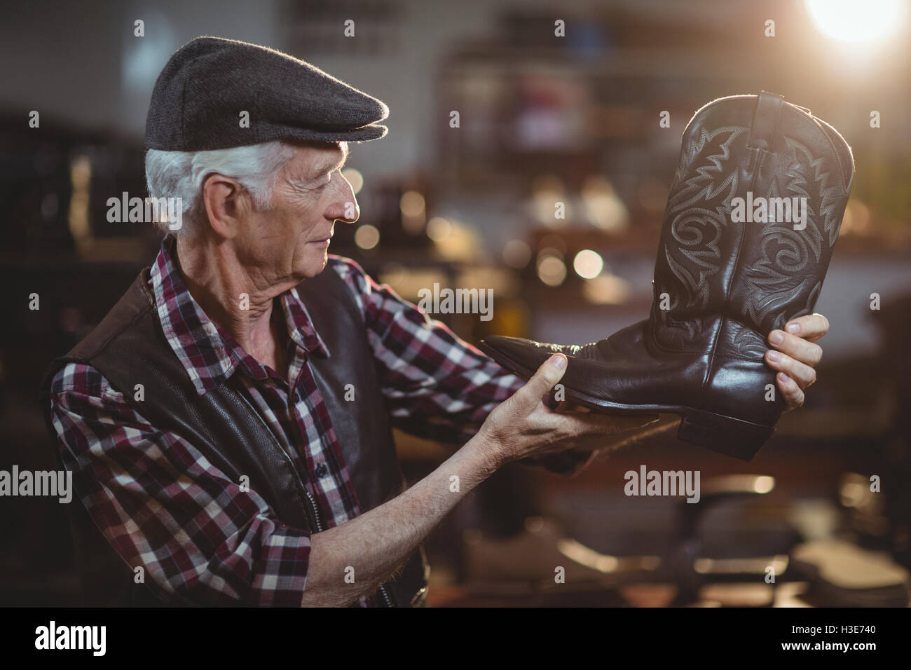 Holding standing concentration examining footwear hi-res stock ...
