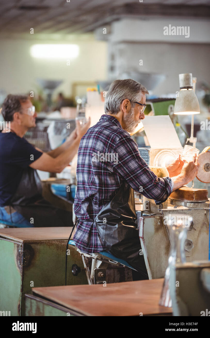 Glassblowers working on a glass Stock Photo - Alamy