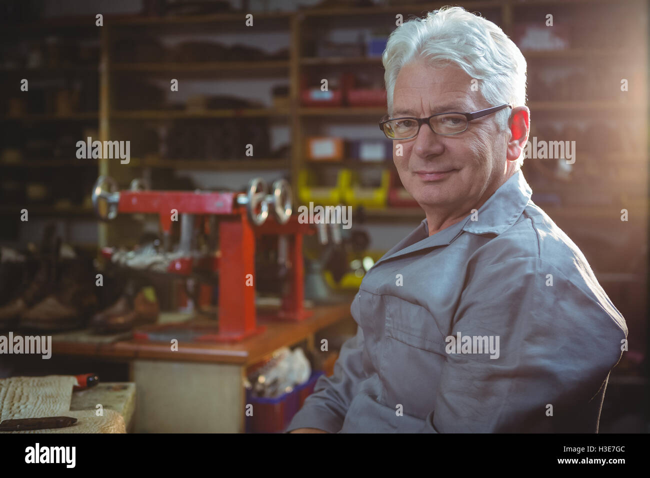 Portrait of shoemaker sitting in workshop Stock Photo - Alamy