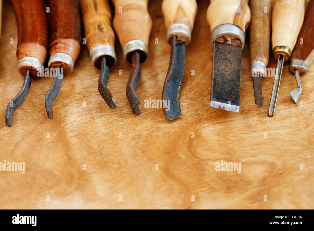 Vintage tools of woodcarving closeup on wooden background Stock Photo ...
