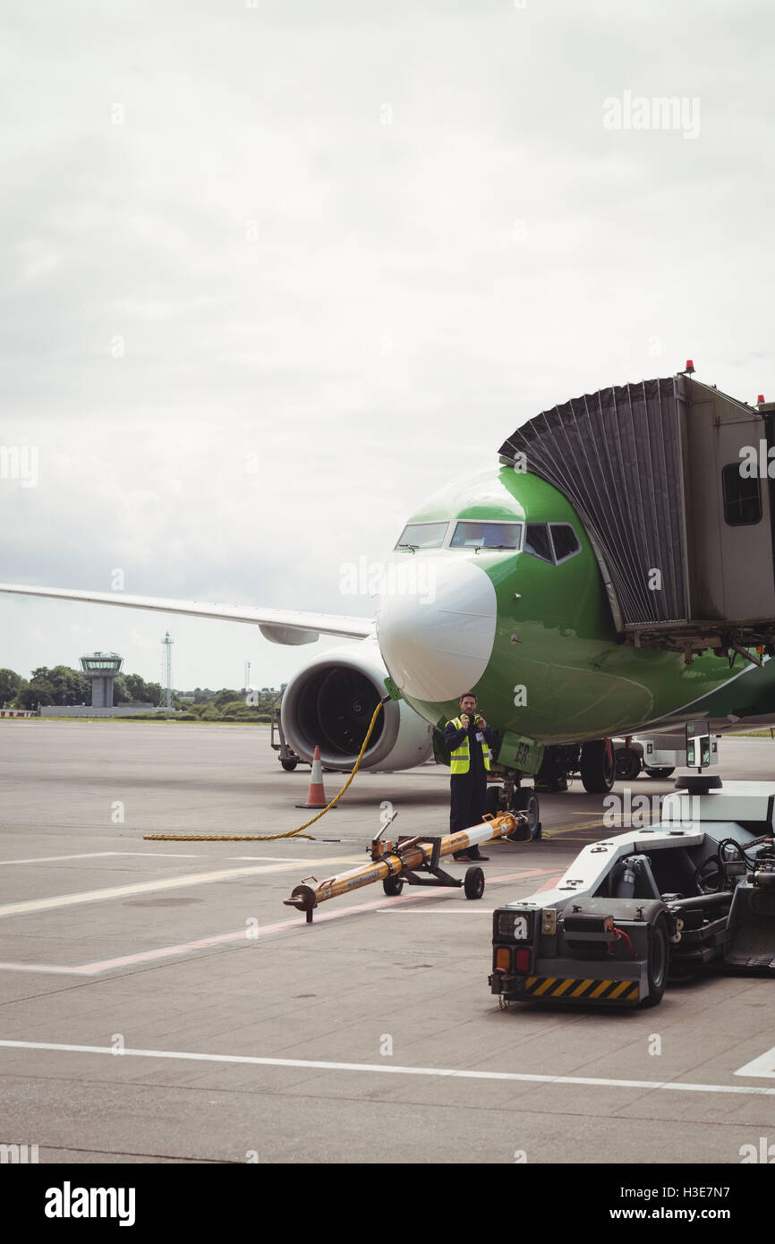 Airplane with loading bridge getting ready for departure Stock Photo ...