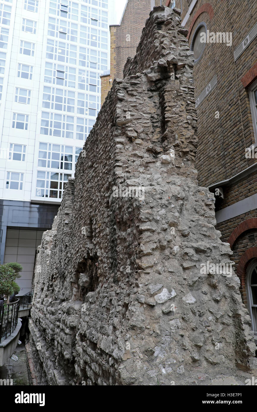 A section of the remaining Roman London Wall amidst modern office ...