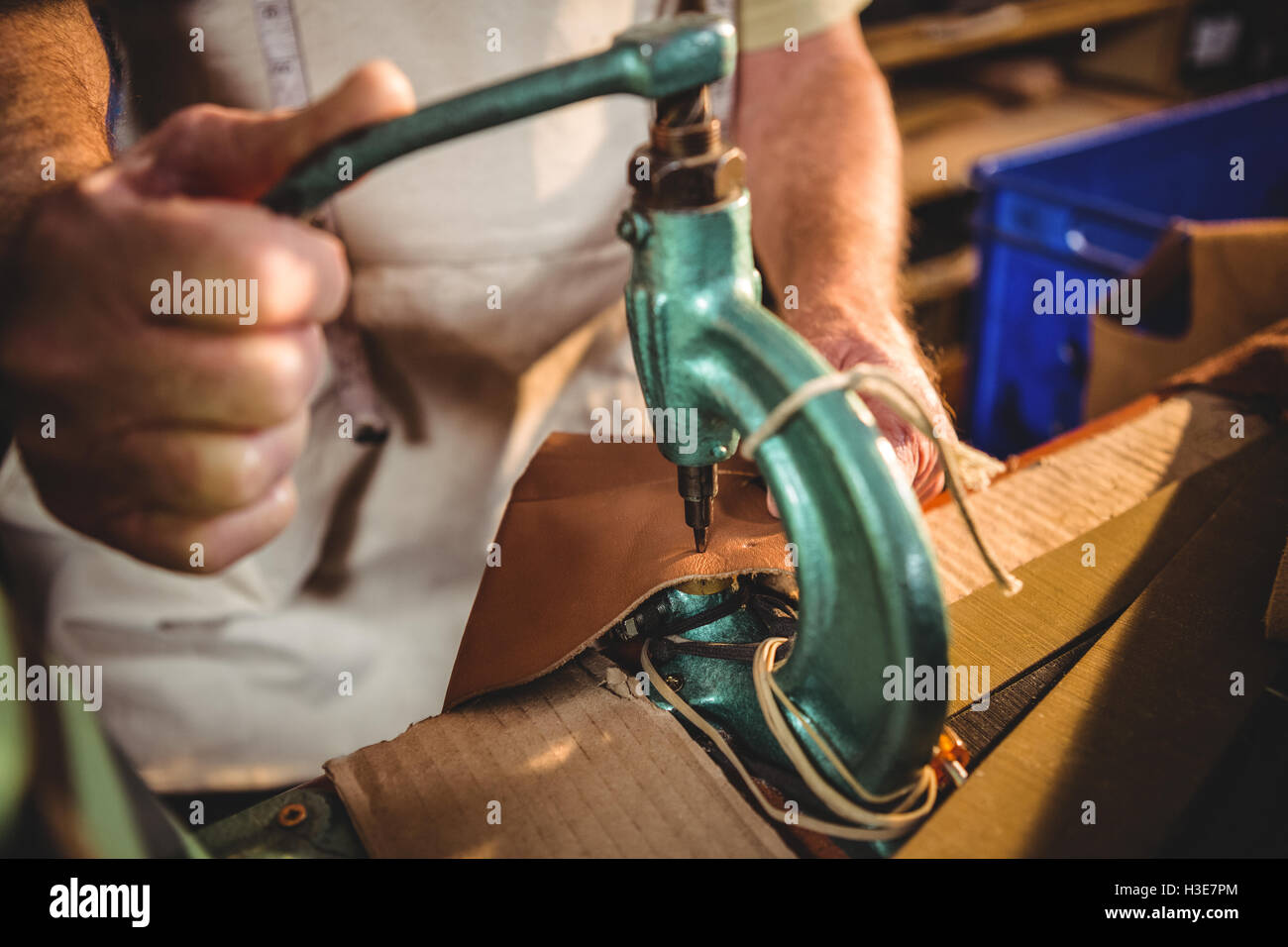 Shoemaker using sewing machine Stock Photo - Alamy