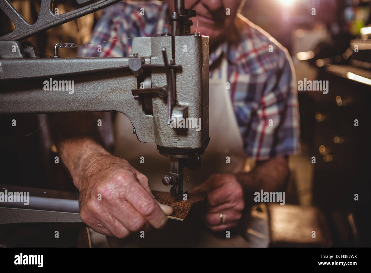 Shoemaker using sewing machine Stock Photo - Alamy