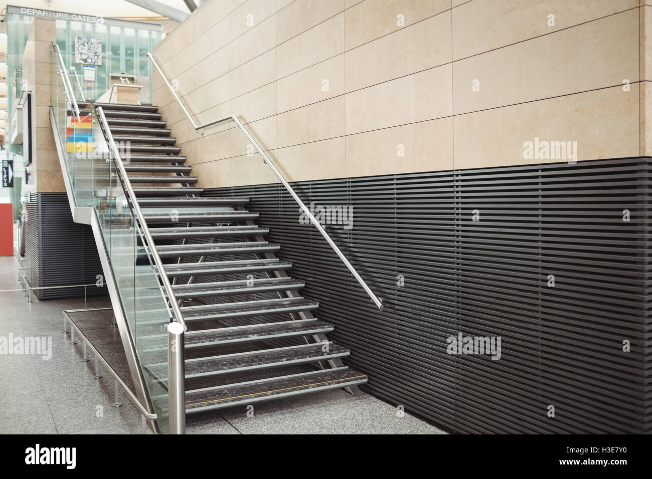 Staircase in airport terminal Stock Photo - Alamy