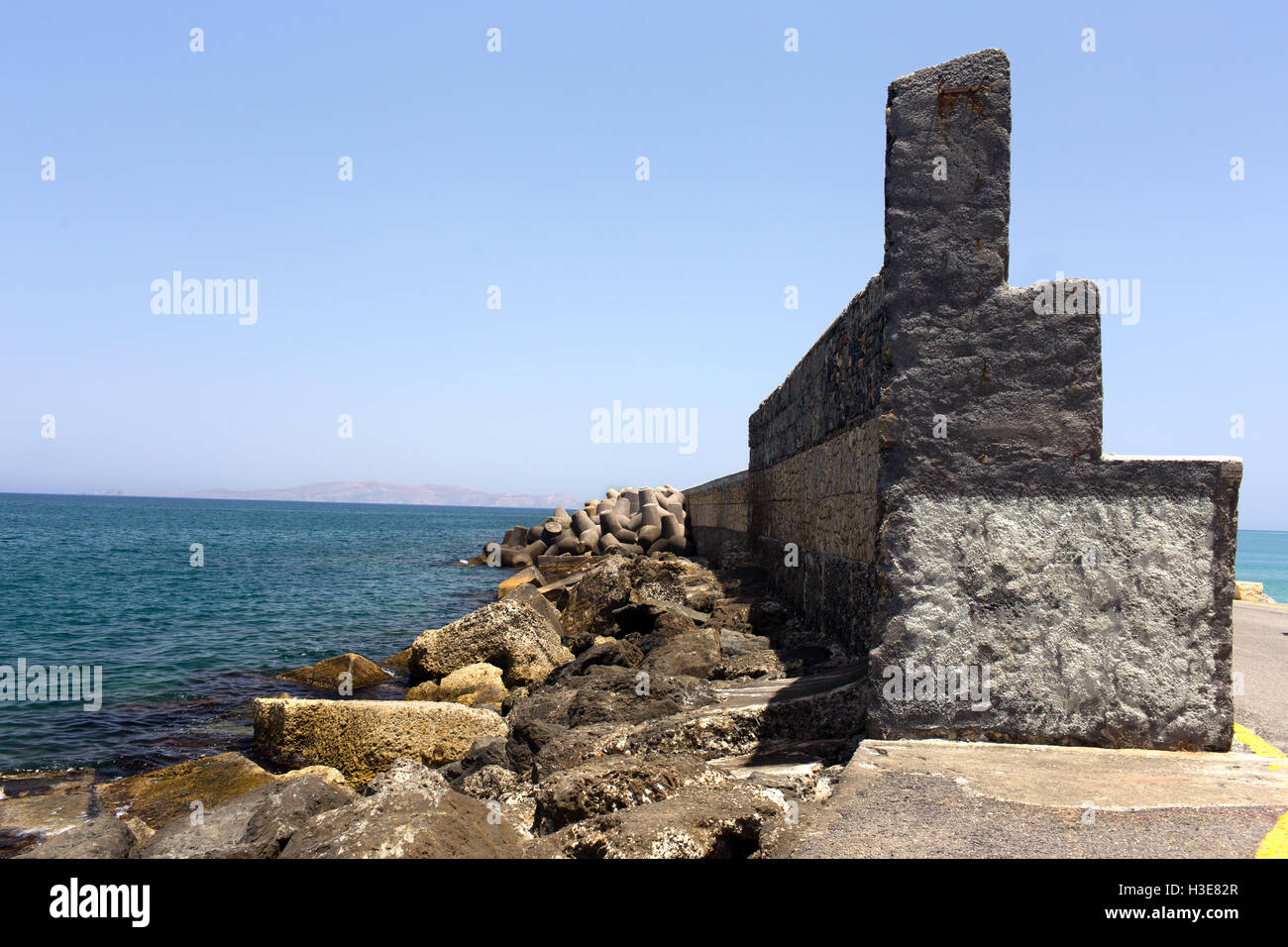Stone pier on the background of the sea Stock Photo - Alamy