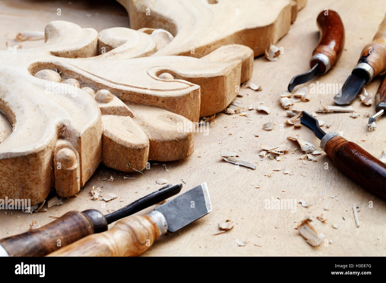 a wood carvings, tools and processes work closeup Stock Photo - Alamy