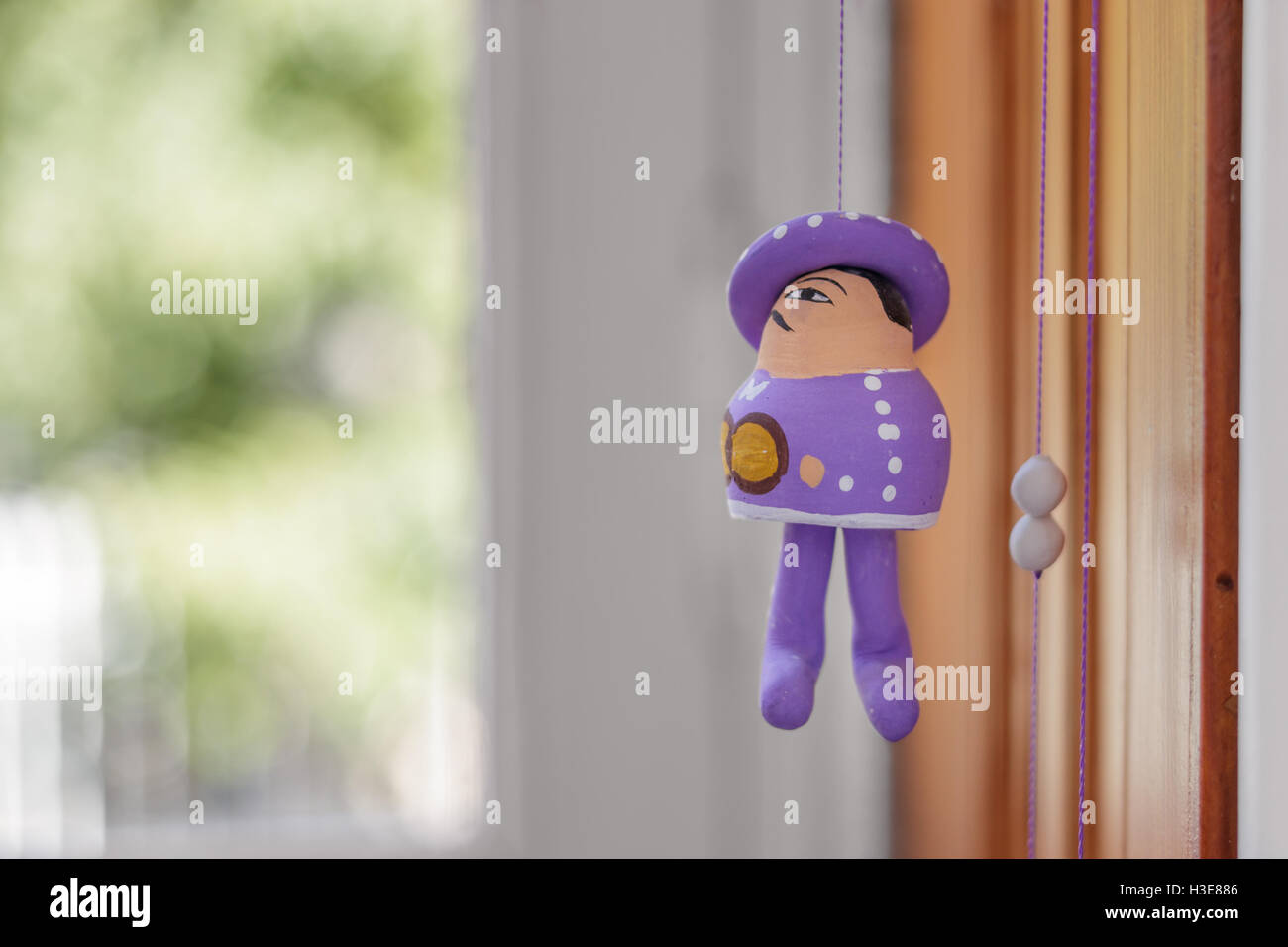 String puppet decoration on a window Stock Photo - Alamy