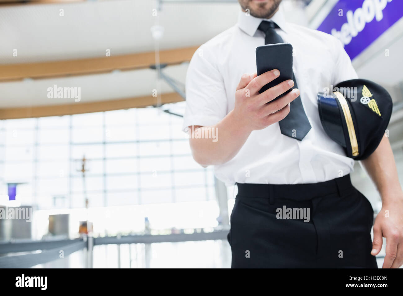 Pilot using mobile phone Stock Photo - Alamy