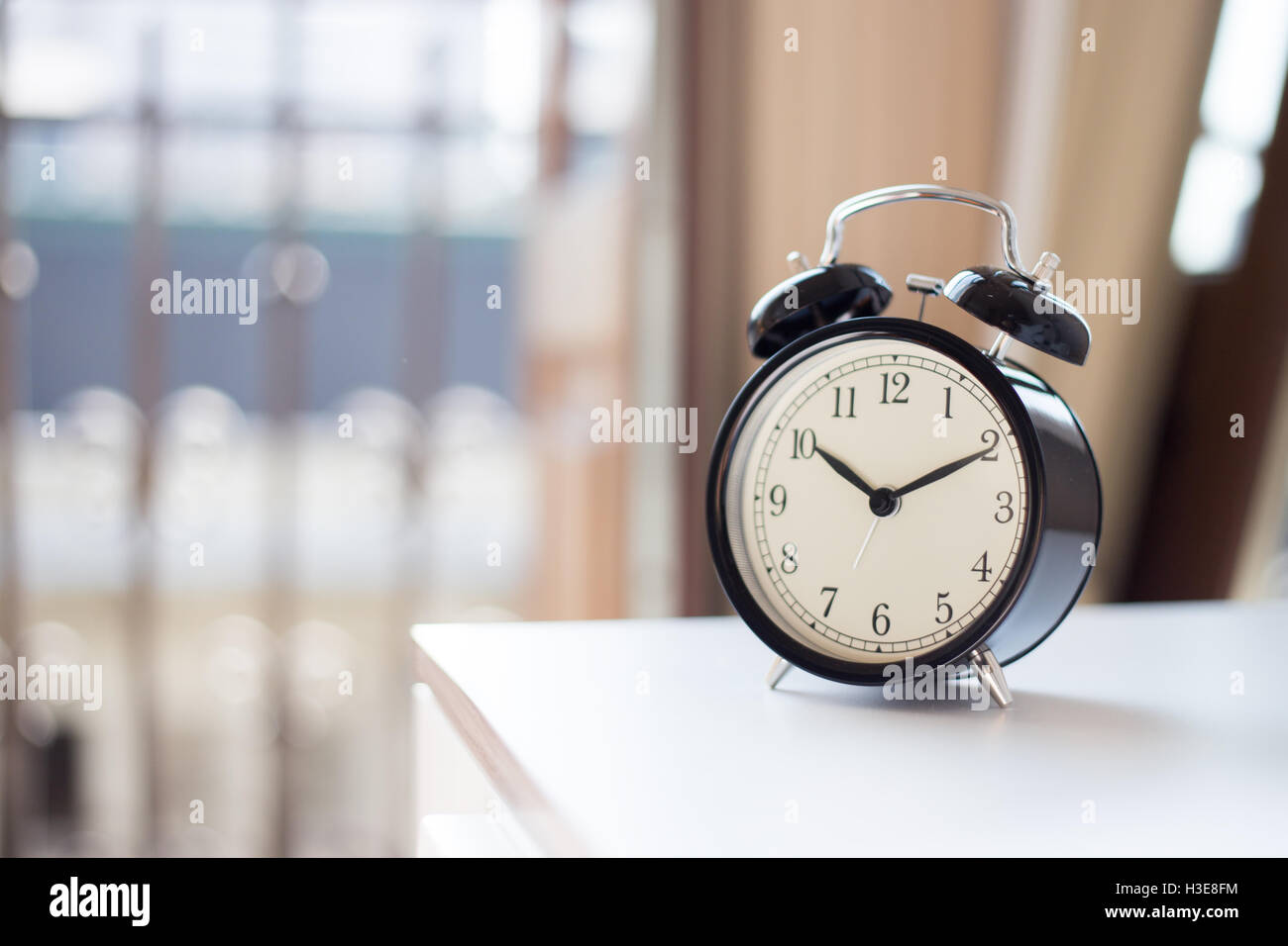 Alarm clock on the nightstand Stock Photo - Alamy