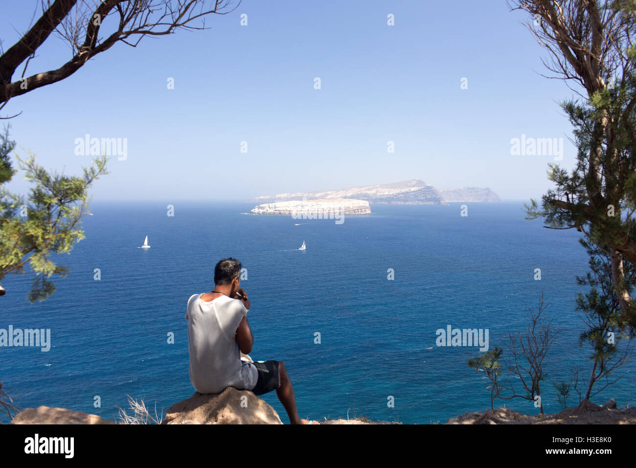 Pensive man looking at sea Stock Photo - Alamy