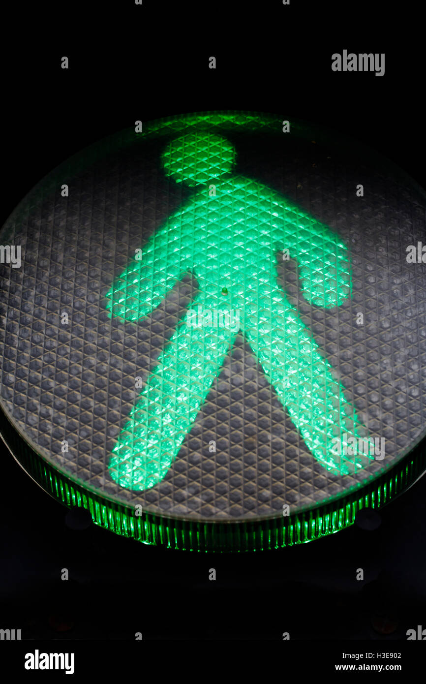 green traffic sign for pedestrians, traffic rules Stock Photo - Alamy