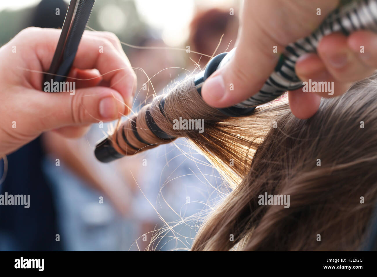 master hairdresser and stylist in the workflow closeup Stock Photo - Alamy