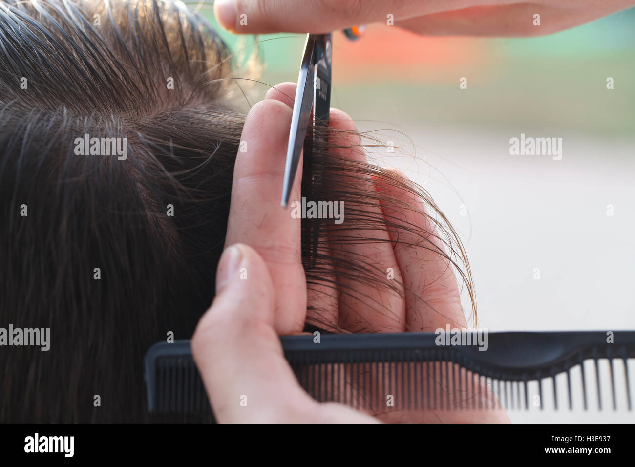 master hairdresser and stylist in the workflow closeup Stock Photo - Alamy
