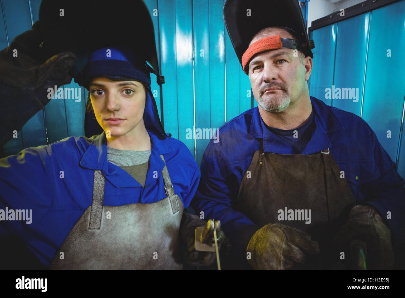 Portrait female welder standing hi-res stock photography and images - Alamy