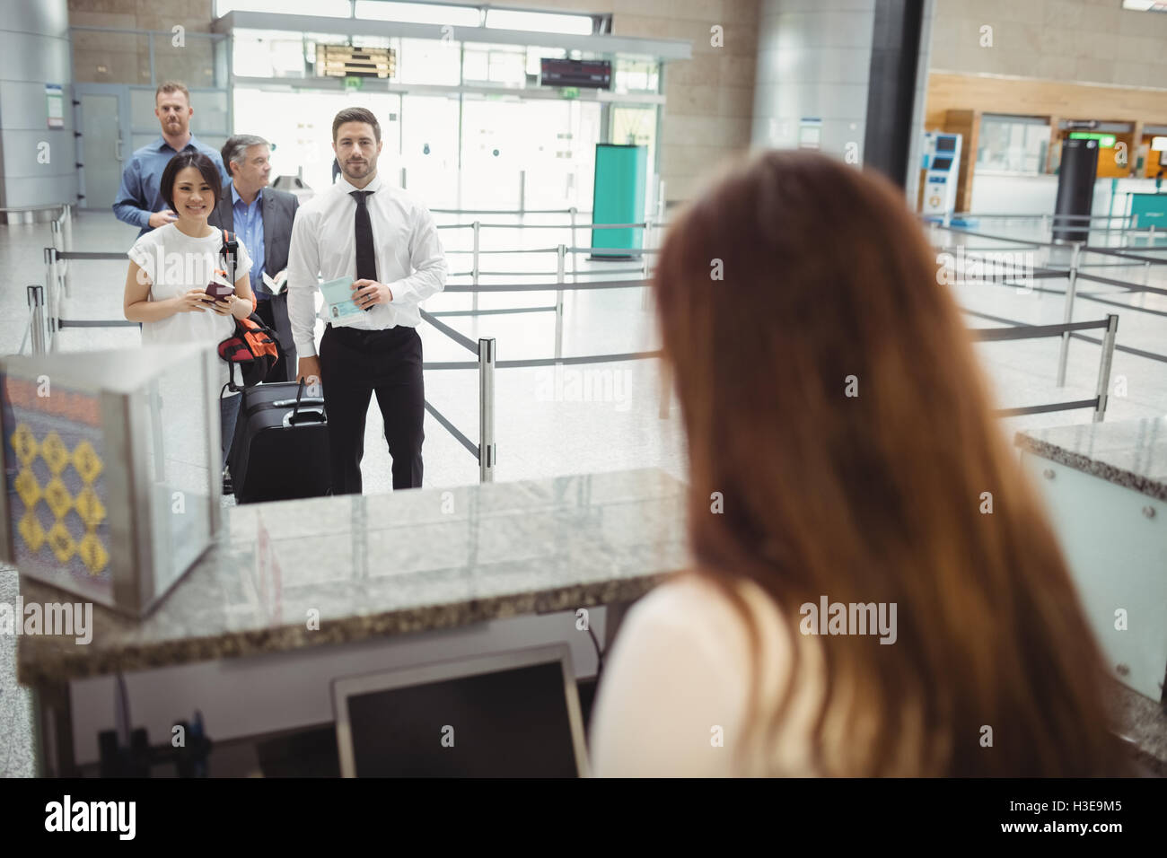 Woman check in counter hi-res stock photography and images - Alamy