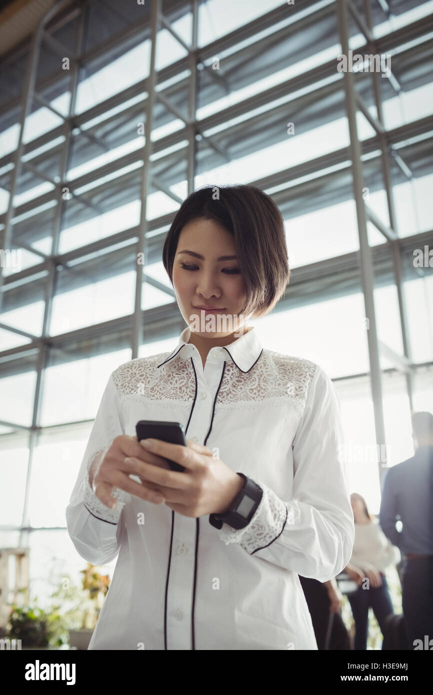 Young female passenger using mobile phone Stock Photo - Alamy