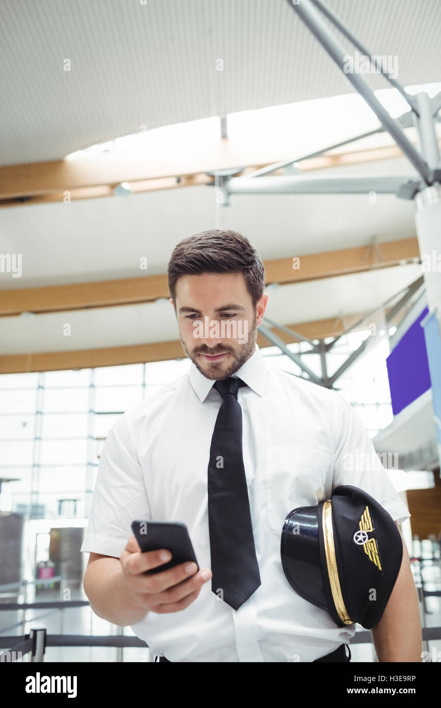 Pilot using mobile phone Stock Photo - Alamy