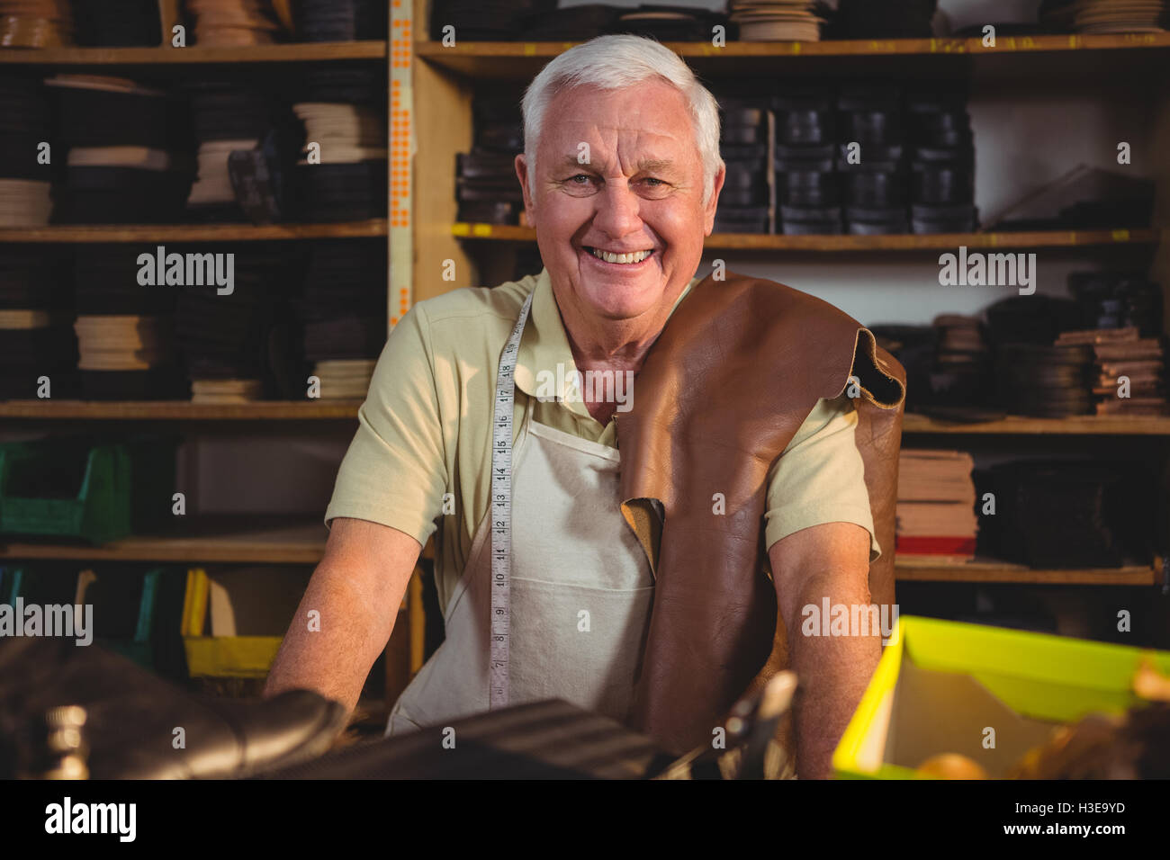 Portrait of shoemaker sitting in workshop Stock Photo - Alamy