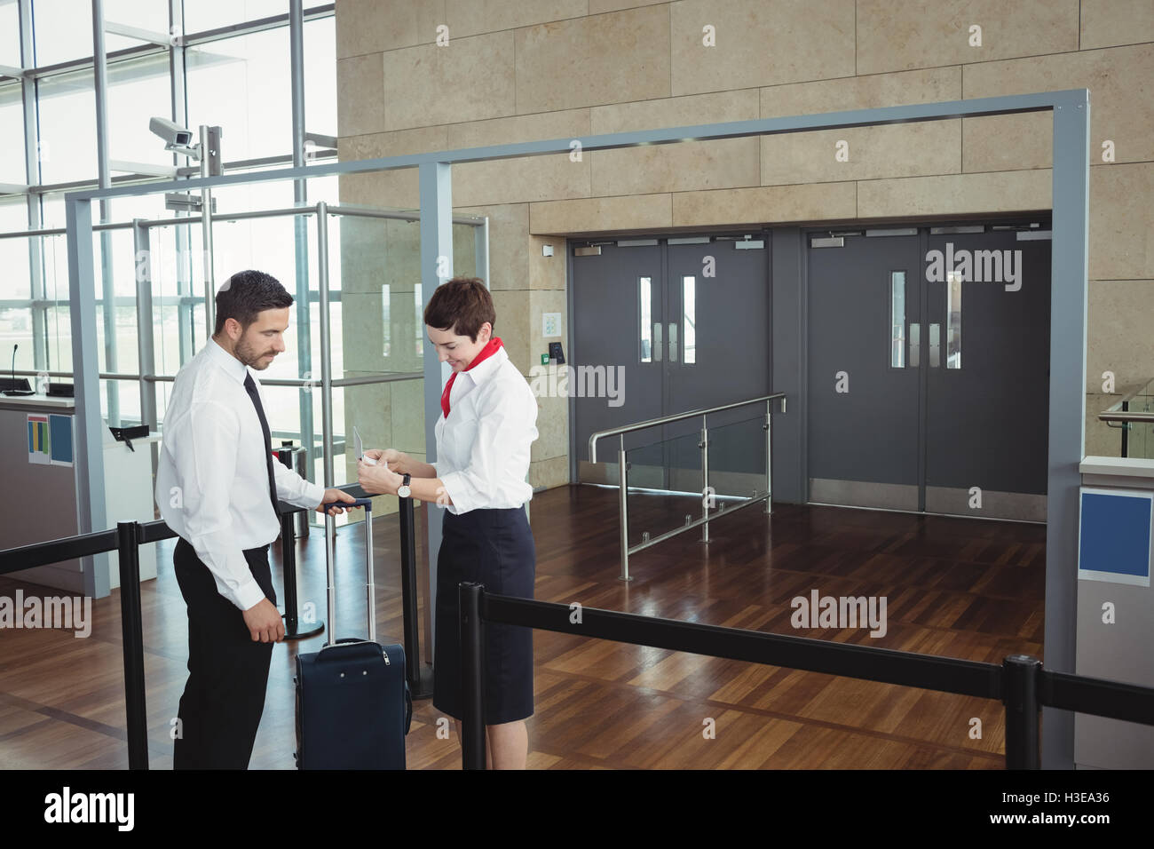 Businessman showing his boarding pass at the check-in counter Stock ...