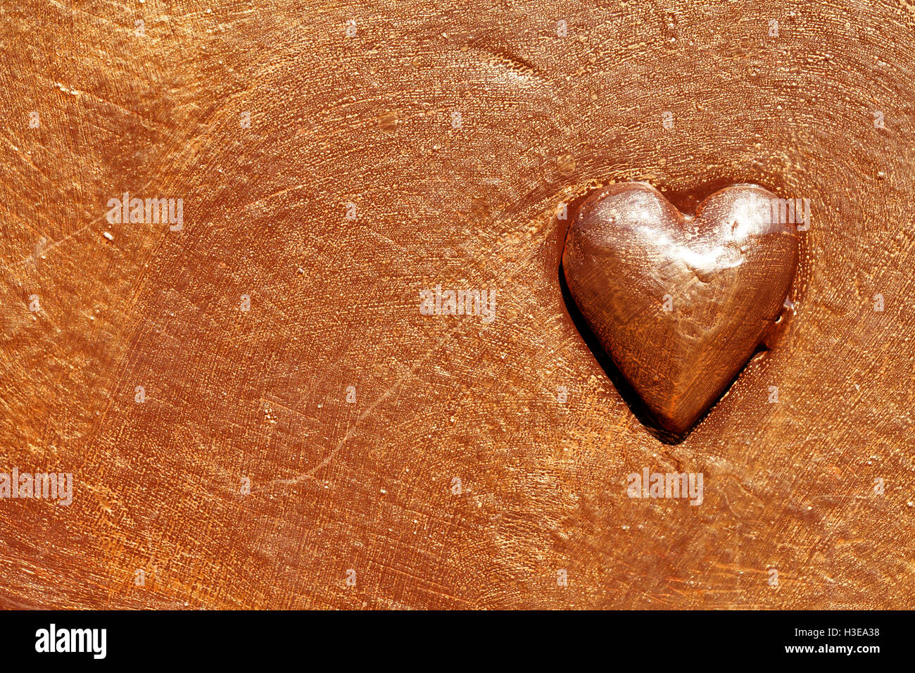 a beautiful heart of metal painted in gold paint Stock Photo - Alamy
