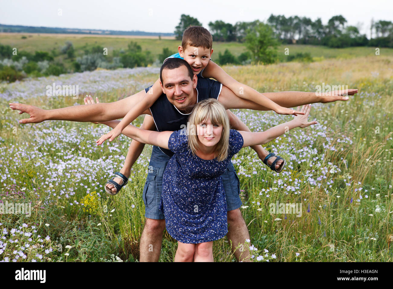 a happy loving family spends a weekend in nature Stock Photo - Alamy