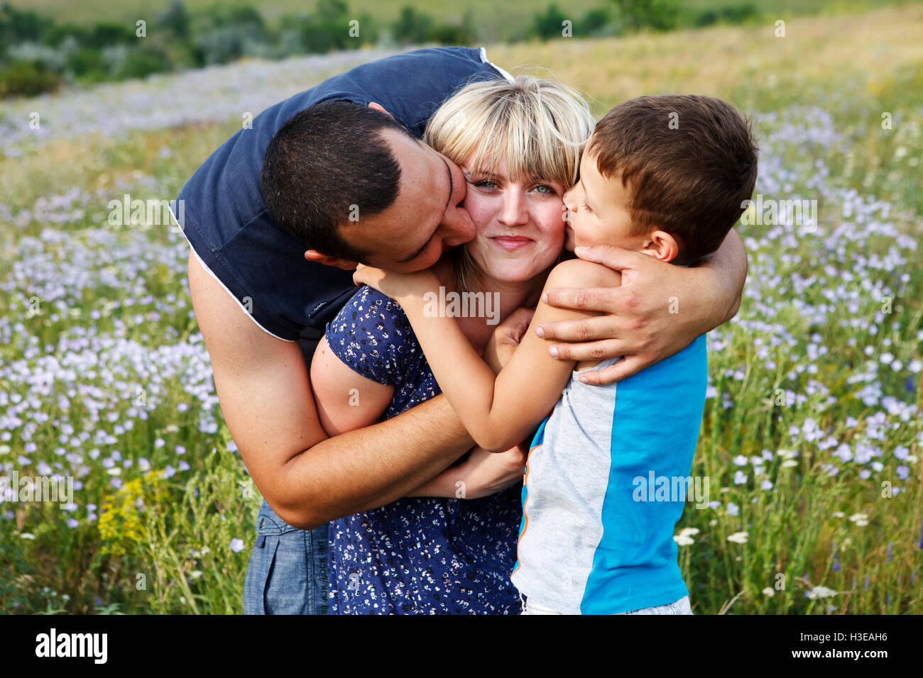 a happy loving family spends a weekend in nature Stock Photo - Alamy