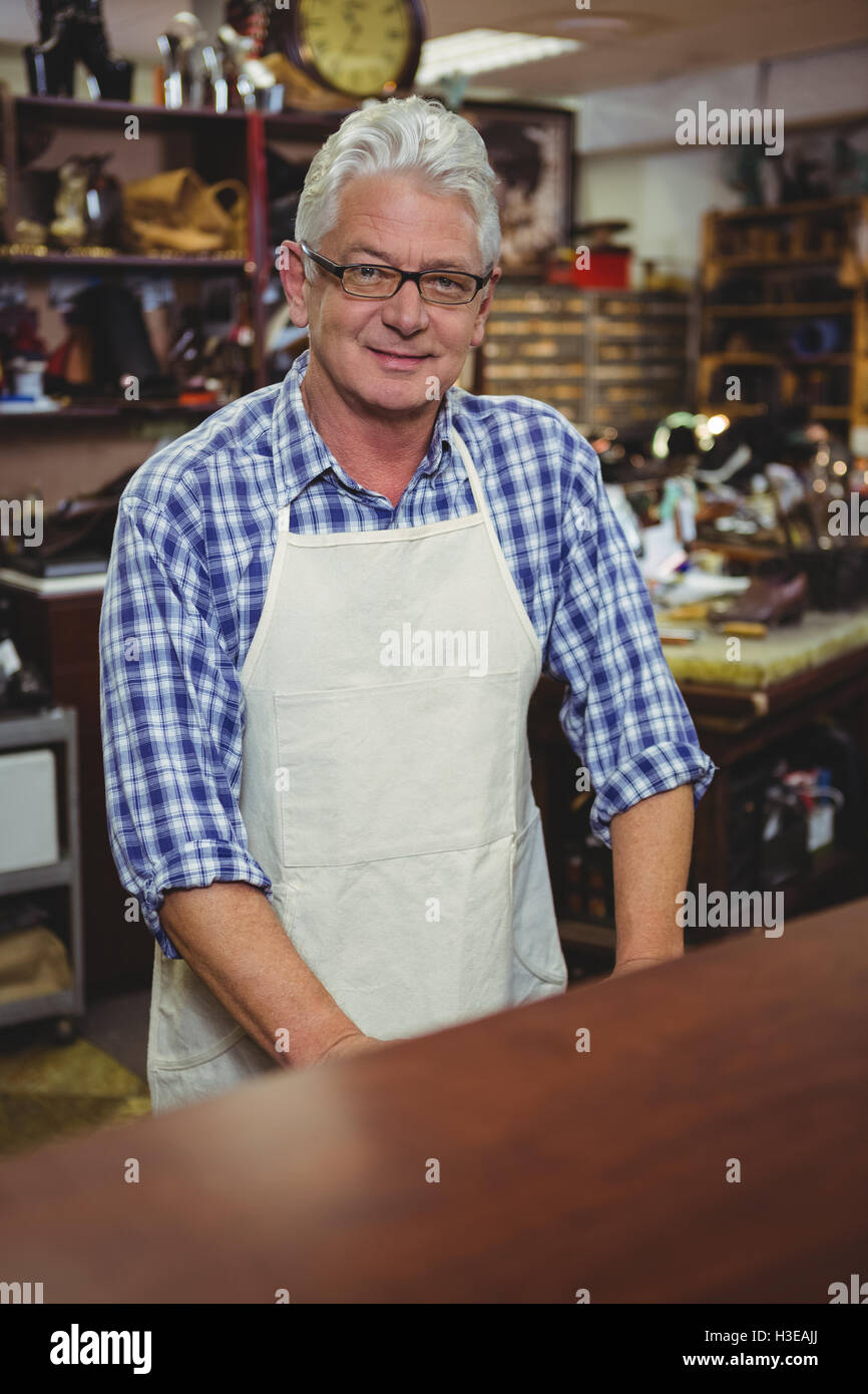 Portrait of shoemaker standing in workshop Stock Photo - Alamy