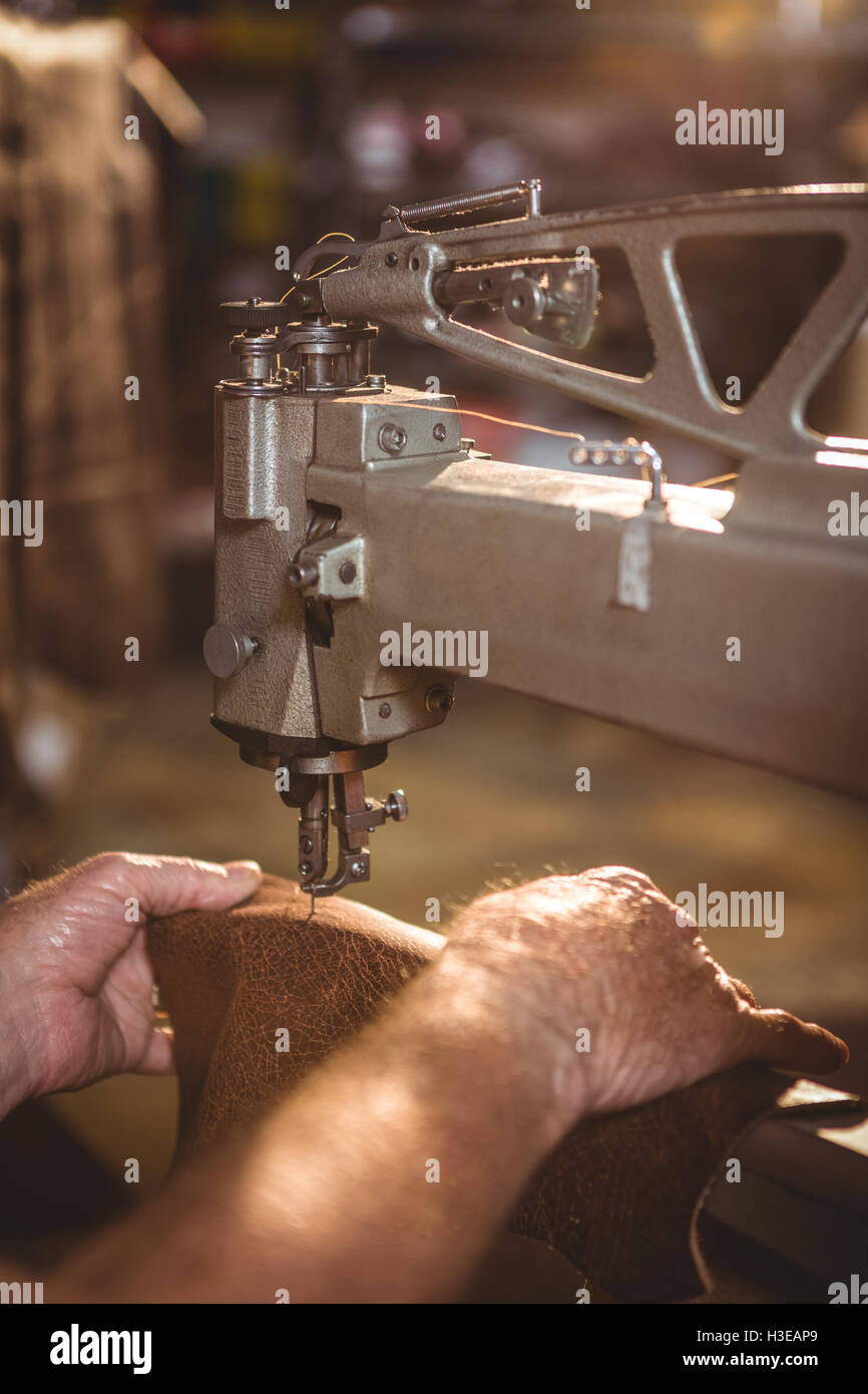 Shoemaker using sewing machine Stock Photo - Alamy