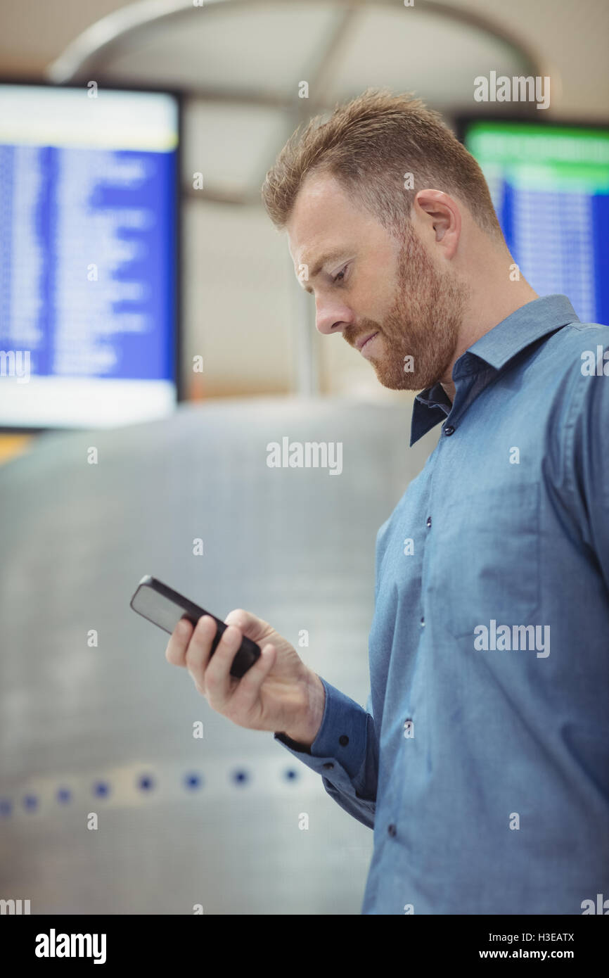 Male passenger using mobile phone Stock Photo - Alamy
