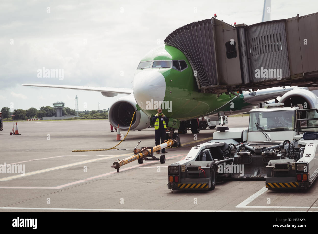 Airplane with loading bridge getting ready for departure Stock Photo ...