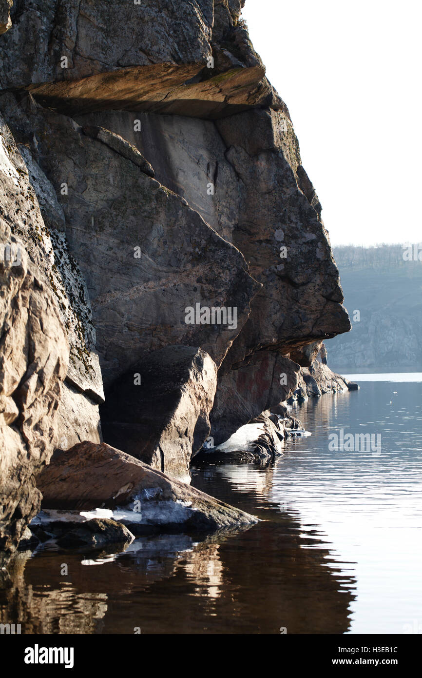 a steep cliffs and reflection in water Stock Photo - Alamy