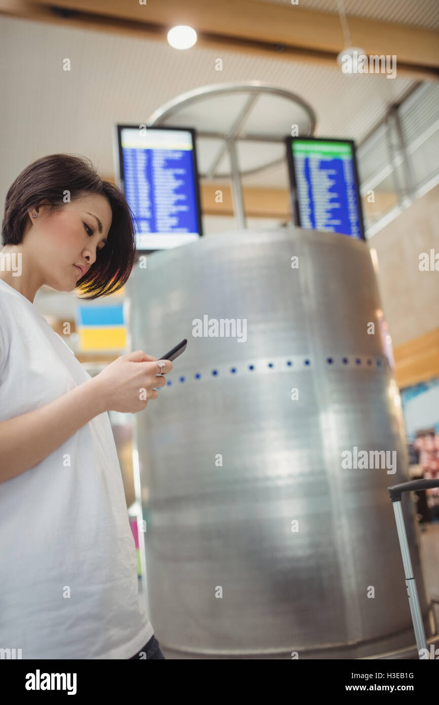 Young female passenger using mobile phone Stock Photo - Alamy