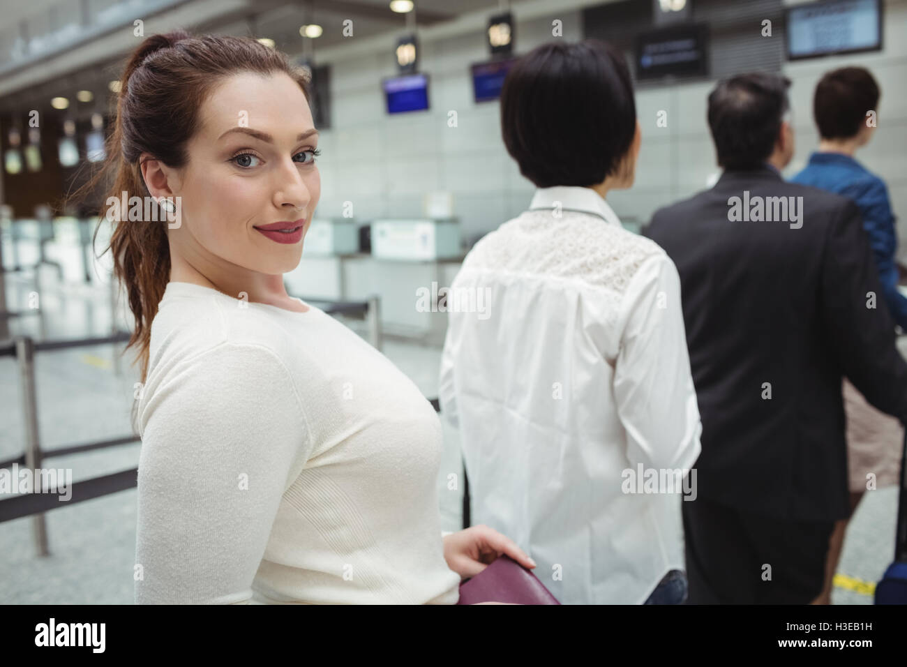 Woman check in counter hi-res stock photography and images - Alamy
