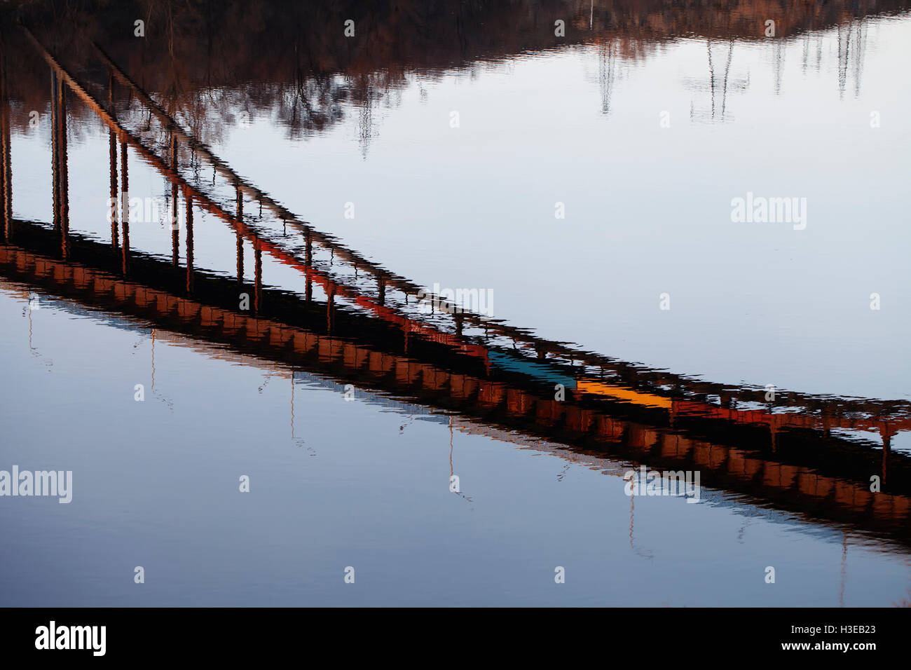 a reflection of the bridge in water , bending facilities Stock Photo ...