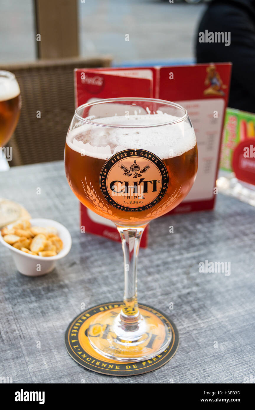A printed glass of Ch'ti lager beer on L'Univers bar table, Bergues ...