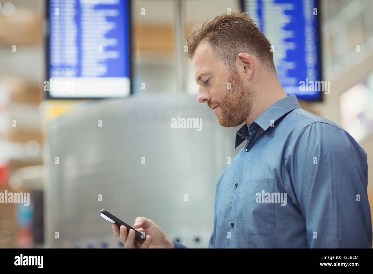 Male passenger using mobile phone Stock Photo - Alamy