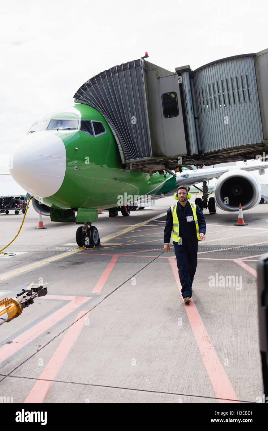 Airplane at the passenger boarding bridge on the runway hi-res stock ...