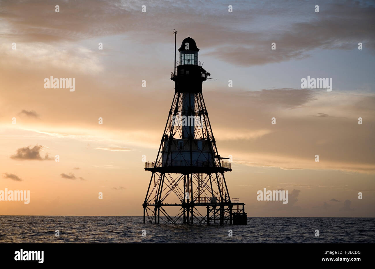 Fowey Rocks Lighthouse, one of Florida's 6 reef lights, is silhouetted ...
