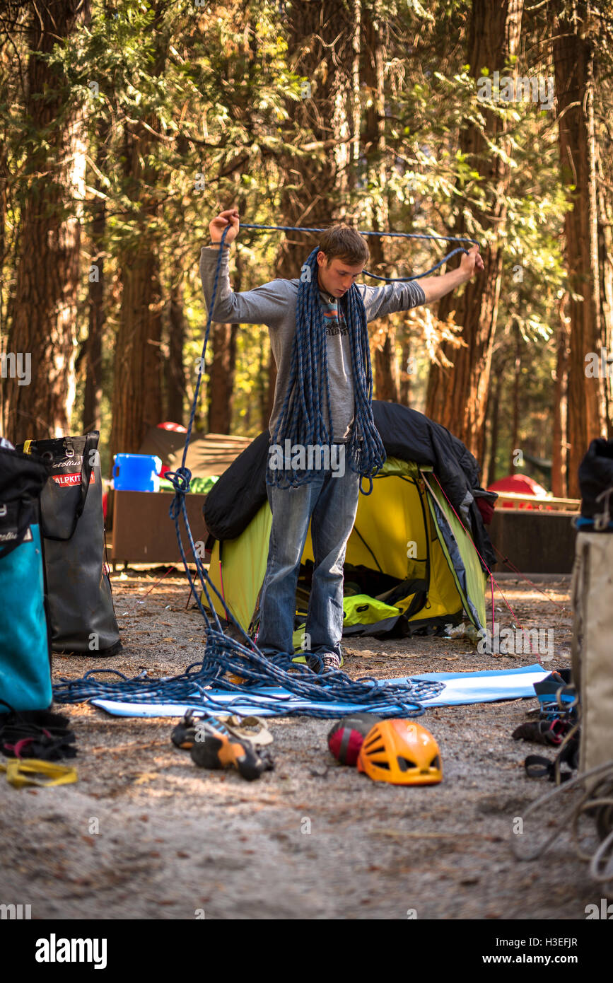 Two climbers racking up before climbing a route on El Capitan. Yosemite ...