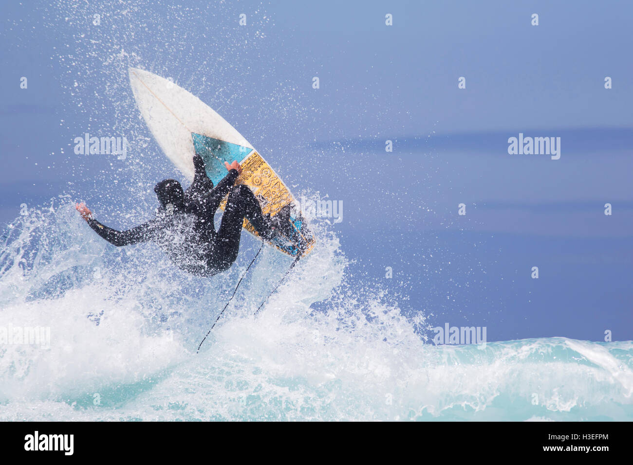 Single Surfer catching some air against a blue sky, Summer, Cornwall,UK ...
