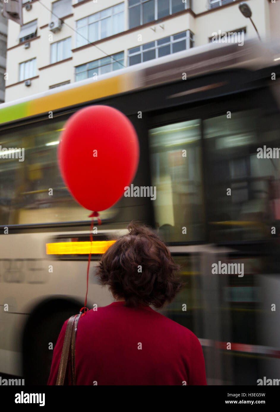 Nostalgia and quality time, elderly woman holds a red balloon in the ...