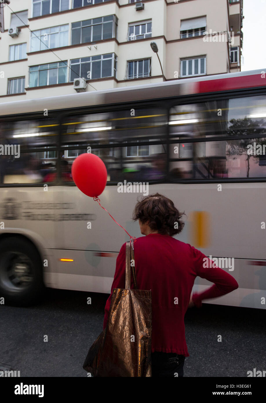 Nostalgia and quality time, elderly woman holds a red balloon in the ...