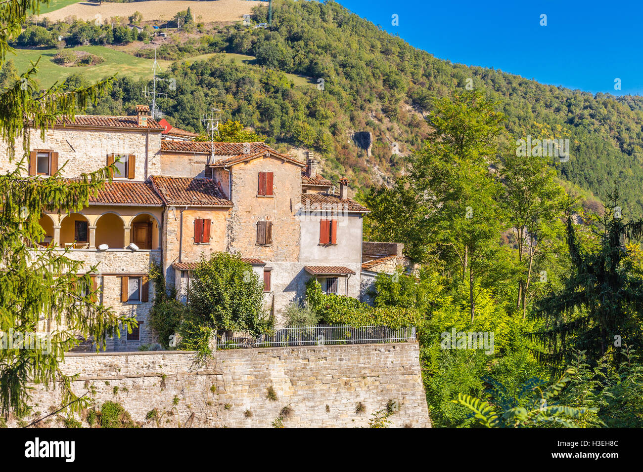 perched houses on ancient fortified ramparts of a medieval village on ...