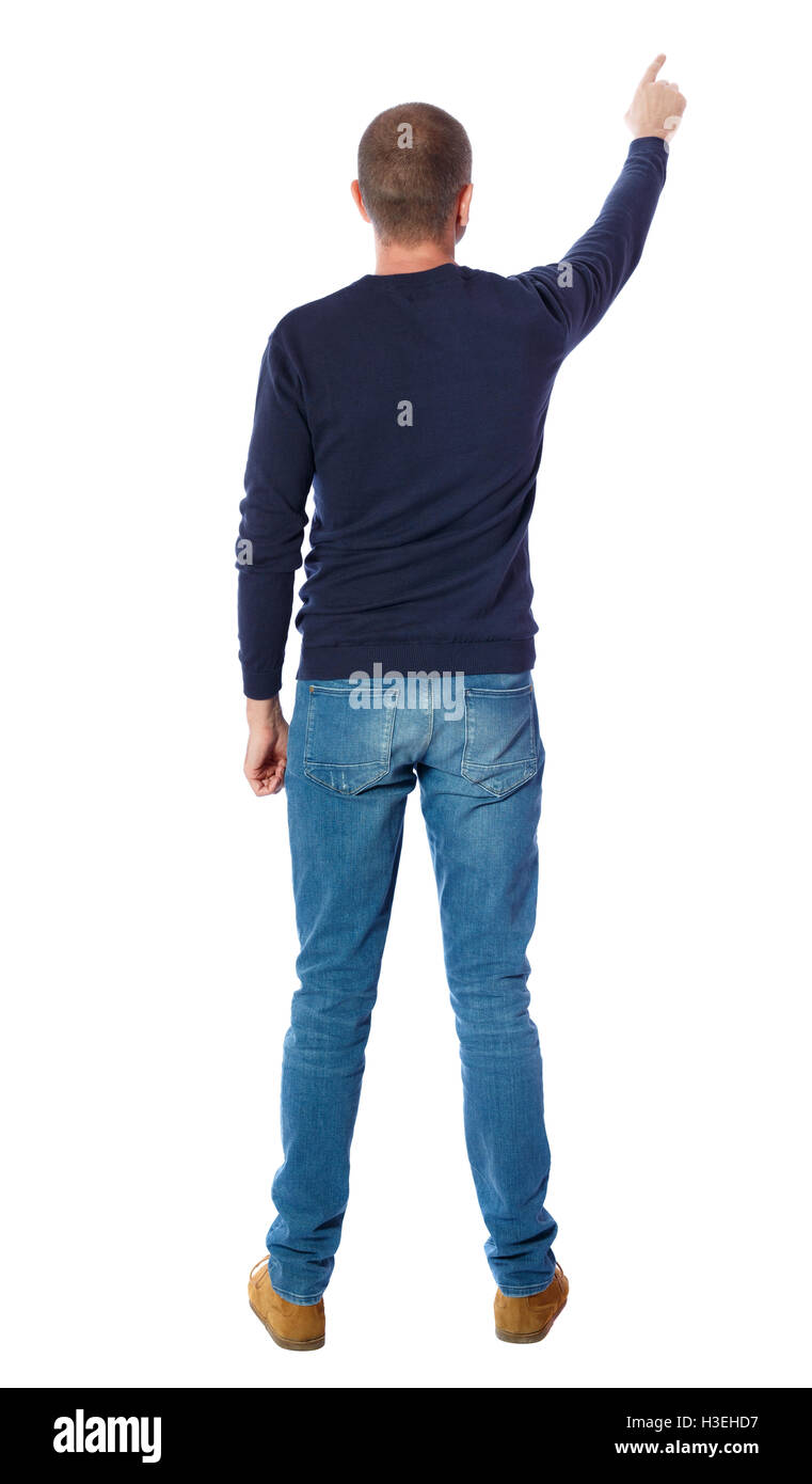 Back view of pointing young men in shirt and jeans. Young guy gesture ...