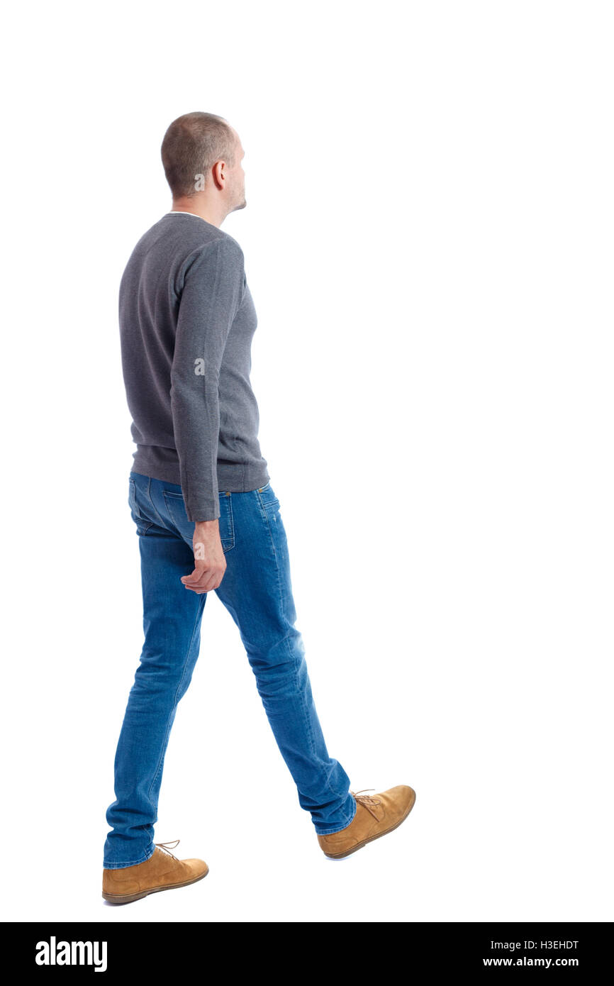Back view of going handsome man. walking young guy . Rear view people ...