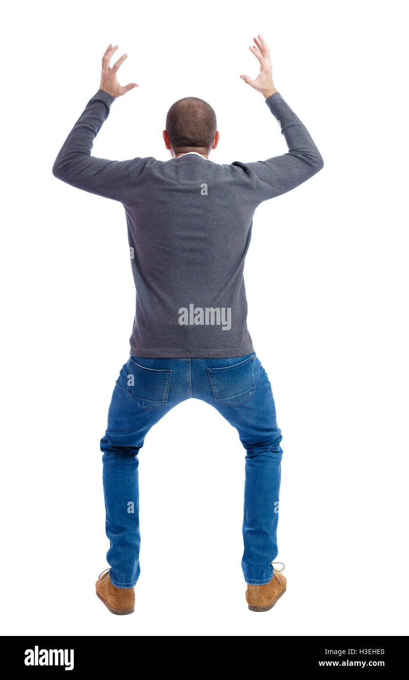 Back view of shocked man . upset young guy in jeans and shirt. Rear ...